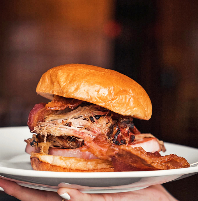 The sandwich that launched a thousand road trips. Stacked higher than Detroit's comeback hopes and twice as satisfying.