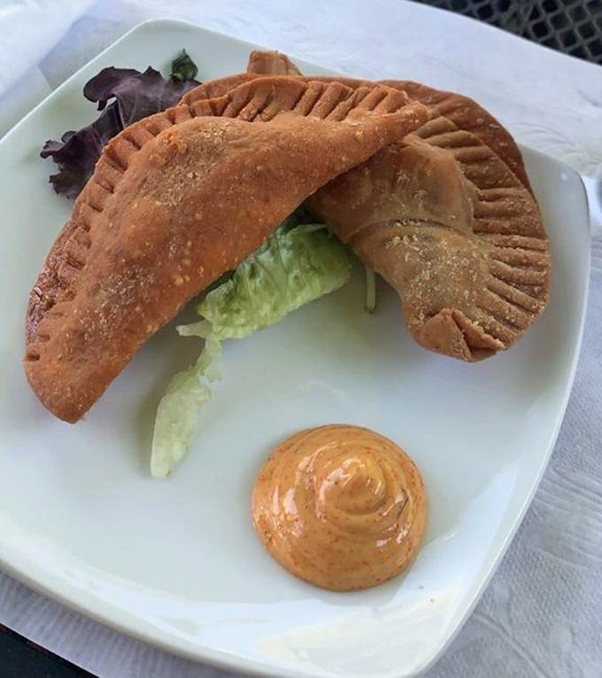 These empanadas aren't just stuffed&mdash;they're blessed with a perfectly crimped edge and golden crust. The accompanying sauce adds a tangy exclamation point.