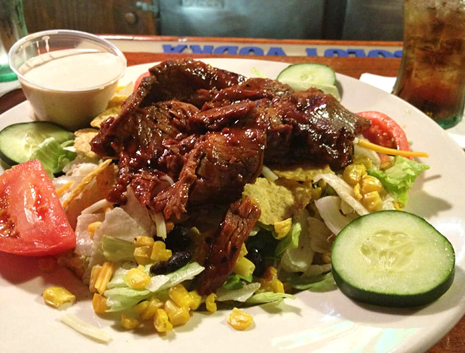 Who says salads can't be exciting? This brisket-topped creation proves vegetables are just a delivery system for smoky meat.