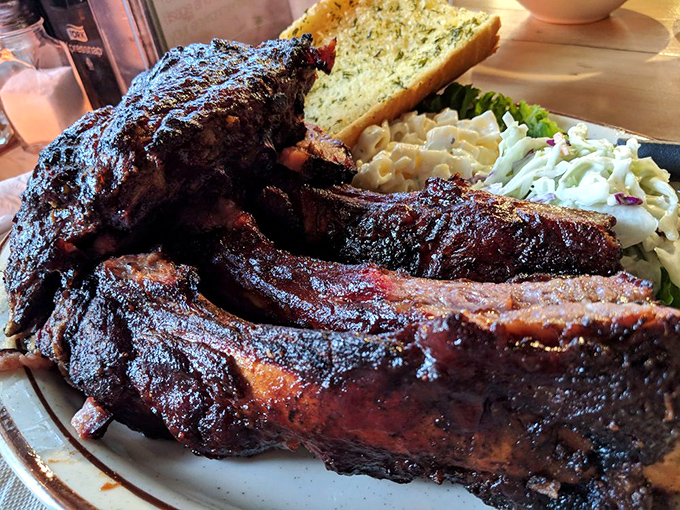 Beef ribs so substantial they look like something Fred Flintstone would order, complete with that glistening bark that barbecue dreams are made of.