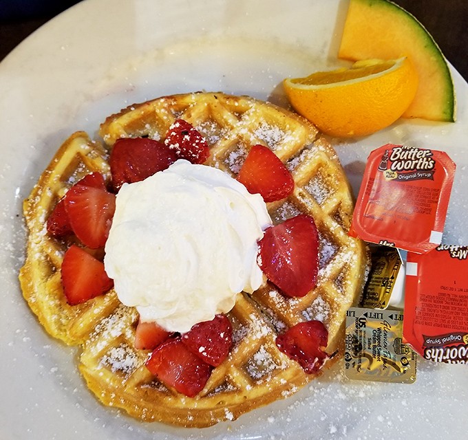 This Belgian waffle with fresh strawberries and whipped cream is what breakfast dreams are made of &ndash; crisp exterior, fluffy inside, berry perfection.
