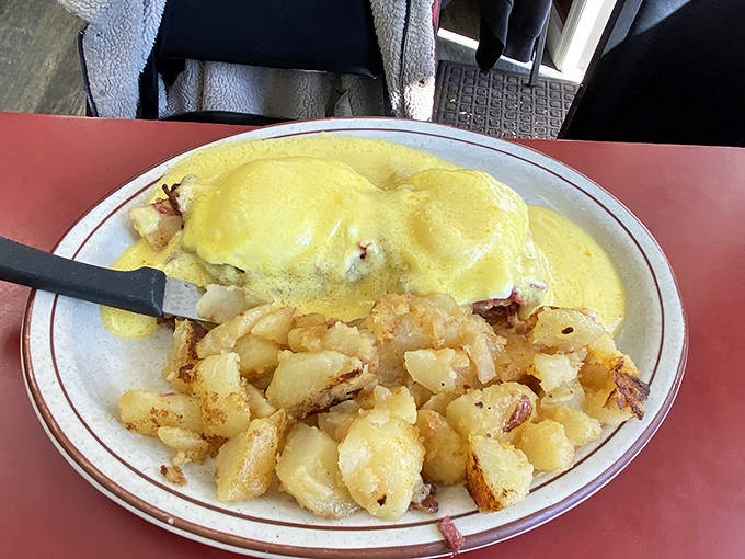 This Benedict isn't just breakfast&mdash;it's morning architecture, with golden home fries providing the perfect foundation for any day worth having.