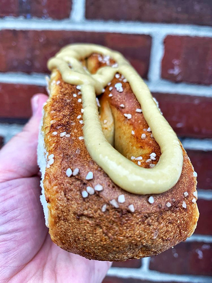 That pretzel isn't just food&mdash;it's an edible delivery system for mustard and happiness. The perfect hand-to-mouth experience. 