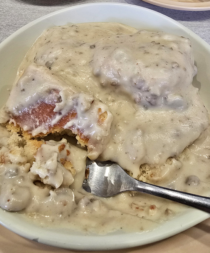 Biscuits drowning happily in a sea of peppery gravy &ndash; the breakfast equivalent of a warm hug from your favorite grandparent.