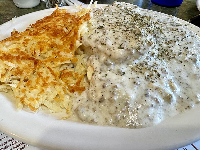 Those hash browns have achieved the perfect crisp-to-tender ratio while that gravy looks like it could solve most of life's problems.