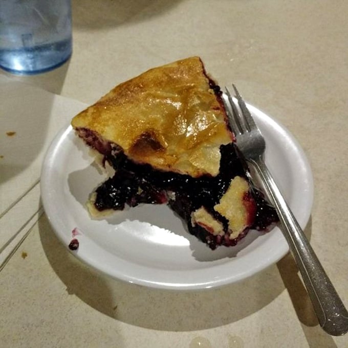 This slice of black raspberry pie isn't just dessert&mdash;it's a purple-hued time machine to your grandmother's kitchen on a summer afternoon.