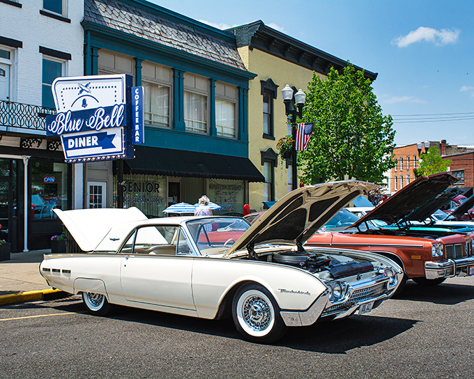 Classic cars line up outside the Blue Bell Diner, where breakfast specials come with a side of automotive nostalgia and friendly conversation.