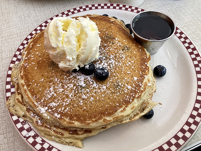 Pancakes topped with a scoop of vanilla ice cream and fresh blueberries&mdash;because sometimes breakfast should feel like you're getting away with something.