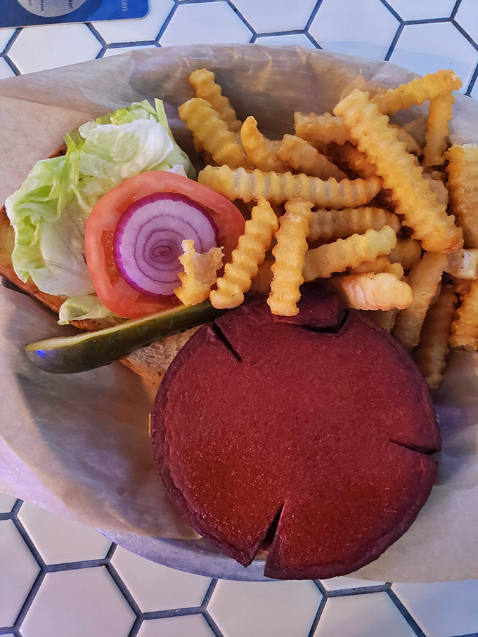 The humble bologna sandwich gets a gourmet makeover with crispy edges, crinkle-cut fries, and the kind of presentation that makes you rethink lunch memories.