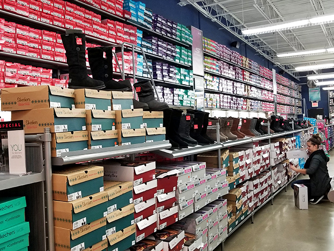 Boot paradise stretches as far as the eye can see. In Ohio, where winter lasts half the year, this wall of footwear isn't luxury—it's survival gear.