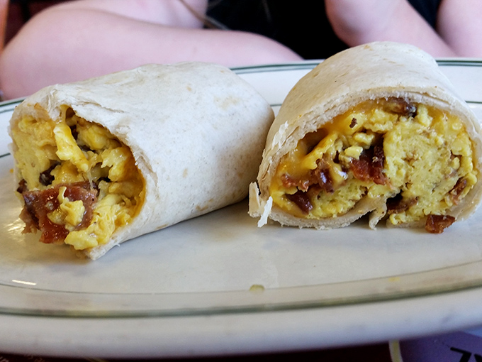Breakfast burritos: where morning meets miracle. These handheld happiness machines pack more flavor than should be legally possible before noon.