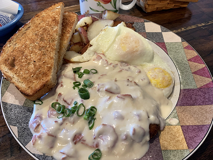 Cream gravy cascading over what appears to be chicken-fried heaven&mdash;this plate doesn't just feed your body, it hugs your soul. 