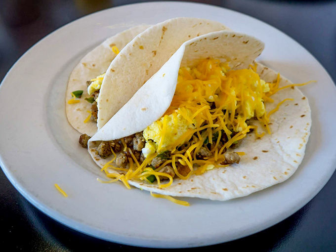 Breakfast tacos: where morning meets Mexico in a hand-held celebration. That melted cheese is performing its sacred duty of binding everything into portable perfection.