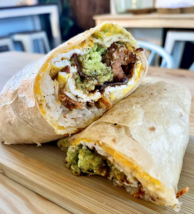 Breakfast burrito perfection&mdash;where eggs, avocado, and protein unite in tortilla harmony. The kind of portable feast worth getting out of bed for.