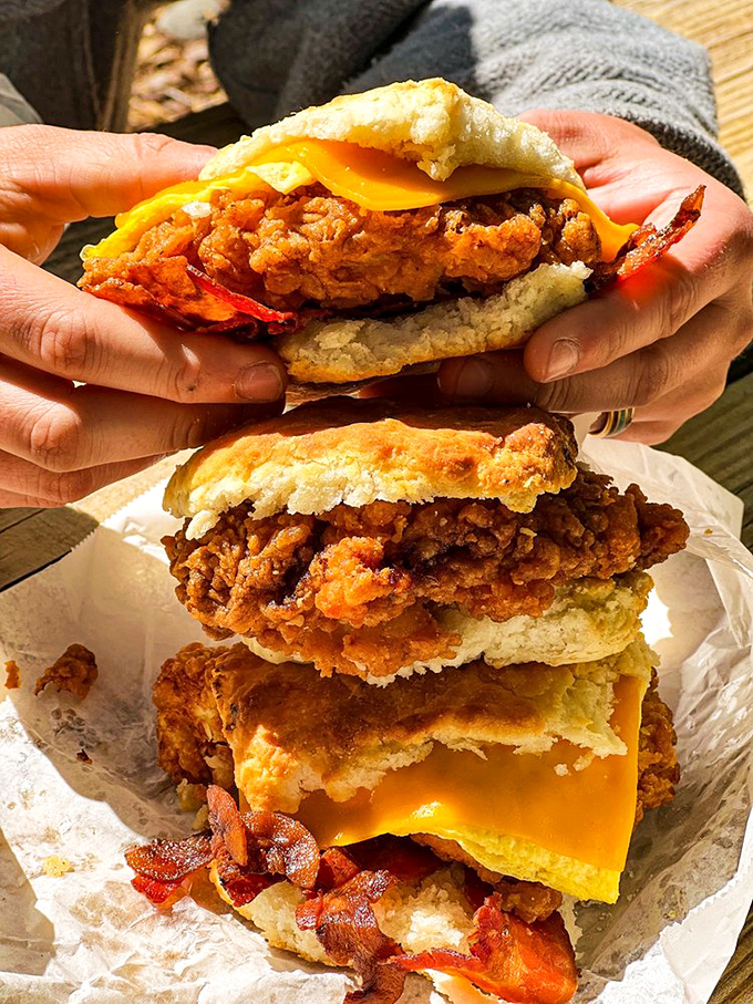 Layer upon layer of breakfast bliss &ndash; crispy fried chicken, melty cheese, and bacon all nestled between halves of that legendary biscuit. Worth every calorie.