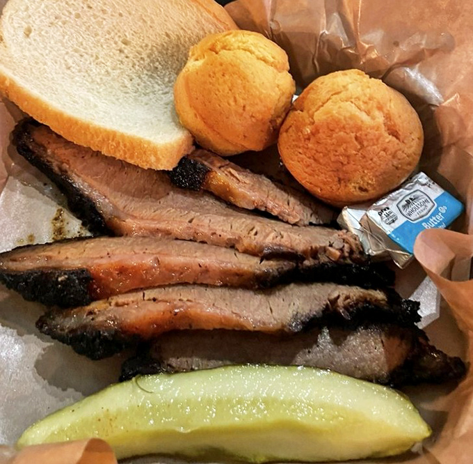 This brisket showcases the perfect smoke ring like a badge of honor, telling stories of patient hours in smoky paradise.