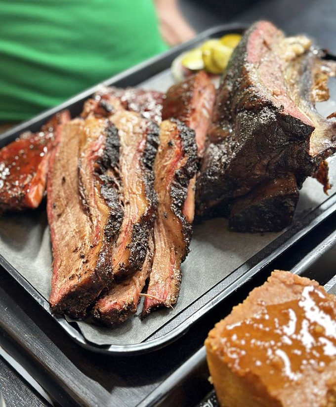 Brisket with that textbook bark and smoke ring that would make a Texan weep with joy. Meat this good doesn't need sauce&mdash;but nobody's judging if you add some.