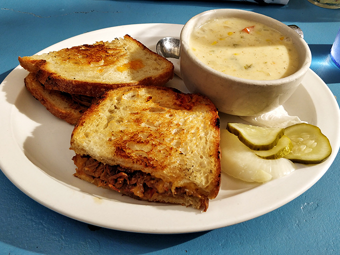 This isn't just a sandwich; it's architecture &ndash; perfectly grilled bread housing a treasure of brisket, with soup standing guard alongside.