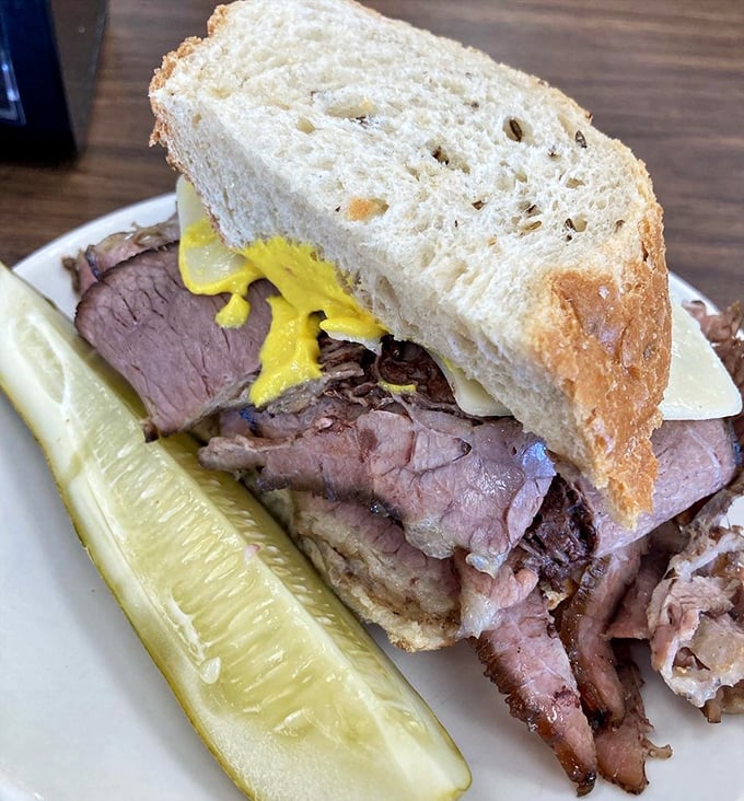 The brisket sandwich that launched a thousand road trips. Tender meat, hearty bread, and that essential pickle&mdash;simplicity that somehow tastes like coming home.