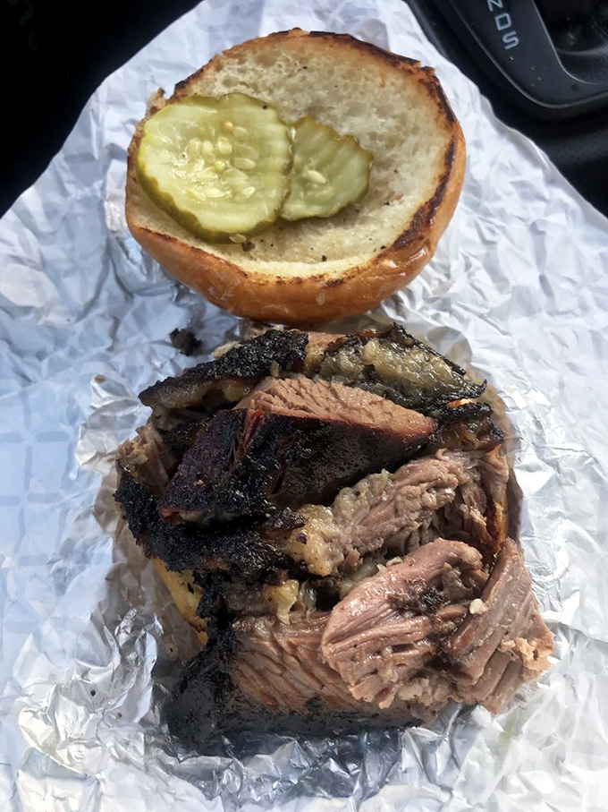 Behold the brisket sandwich &ndash; where smoke-kissed meat meets pickle chips in a romance more compelling than any Hollywood blockbuster.