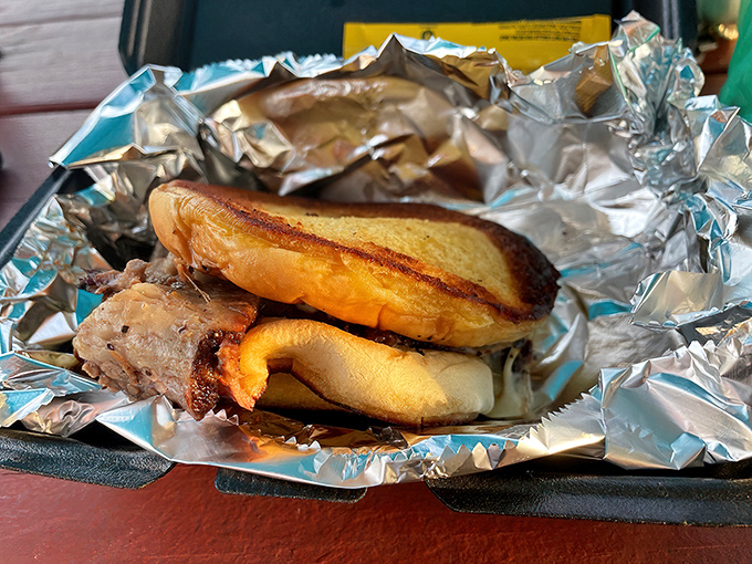 Melty cheese embraces smoky brisket between perfectly toasted bread – a sandwich that demands to be eaten with both hands and zero shame.