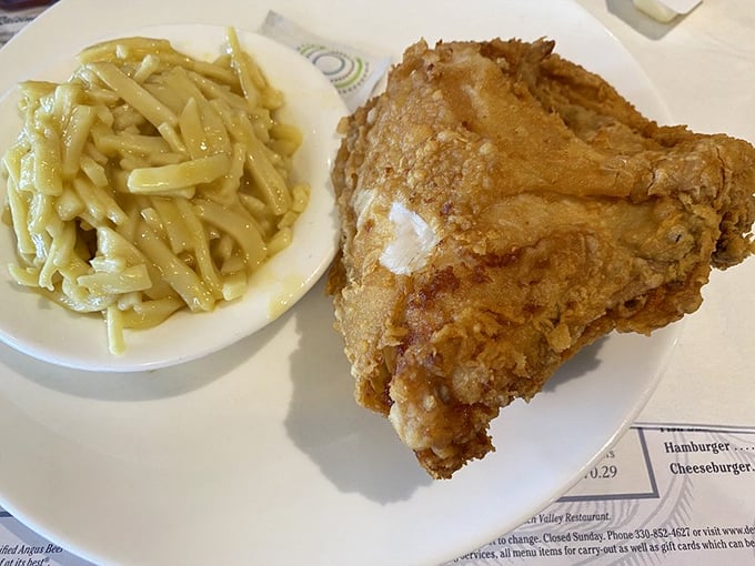 Broasted chicken that renders conversation impossible except for appreciative mumbles. Those noodles aren't just a side&mdash;they're co-stars.