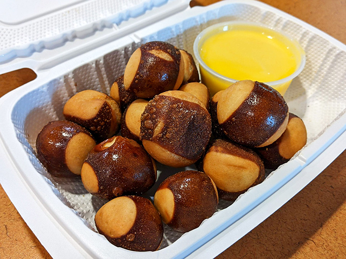 Buckeye Bites with golden dipping sauce &ndash; proof that appetizers aren't just opening acts but sometimes steal the whole show.