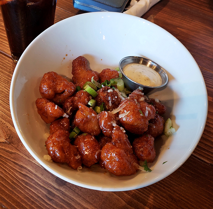 Buffalo cauliflower that makes you question everything you thought you knew about vegetables &ndash; spicy, tangy, and utterly addictive.