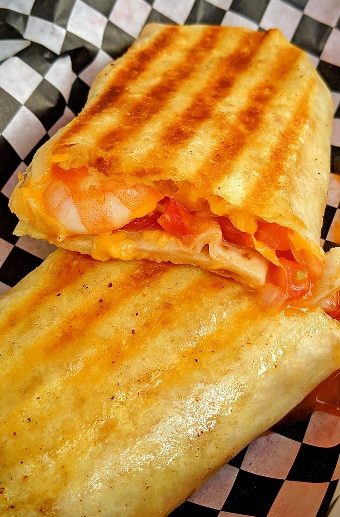 This grilled wrap isn't just lunch; it's what happens when Gulf shrimp meets Florida sunshine in a perfect handheld vacation.