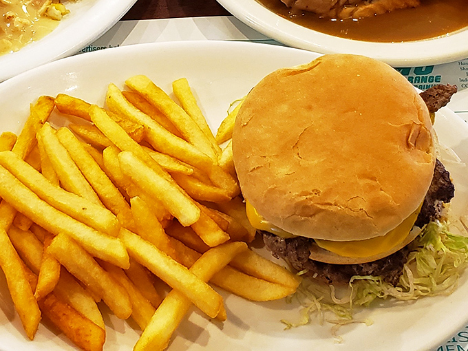 Behold the burger that launched a thousand road trips. Paired with those golden fries, it's the dynamic duo of lunch satisfaction.