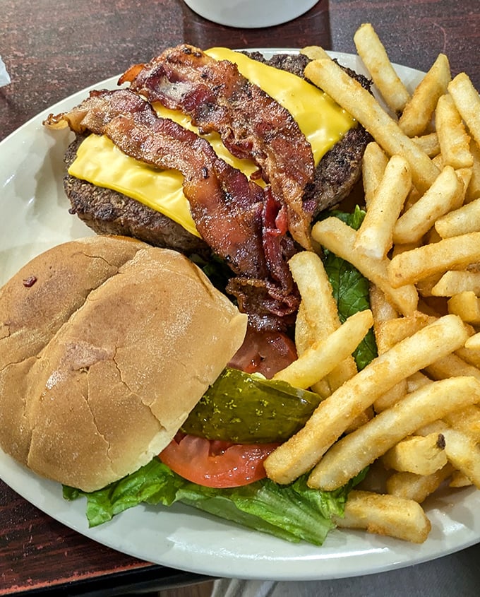 A burger that doesn't need Instagram filters to look good. That melted cheese cascading over perfectly cooked beef is nature's most beautiful waterfall.