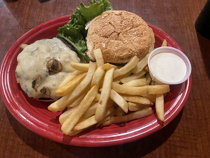 This burger isn't just a meal, it's an architectural achievement &ndash; melted cheese cascading over the patty like a dairy waterfall.