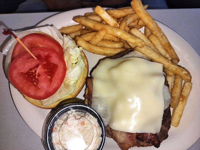 This isn't just a burger&mdash;it's a masterclass in diner perfection with melted cheese cascading over the patty like a dairy waterfall.