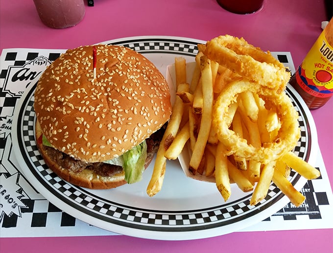The burger arrives with an entourage of golden fries and onion rings&mdash;a reminder that simplicity, when done right, needs no improvement.