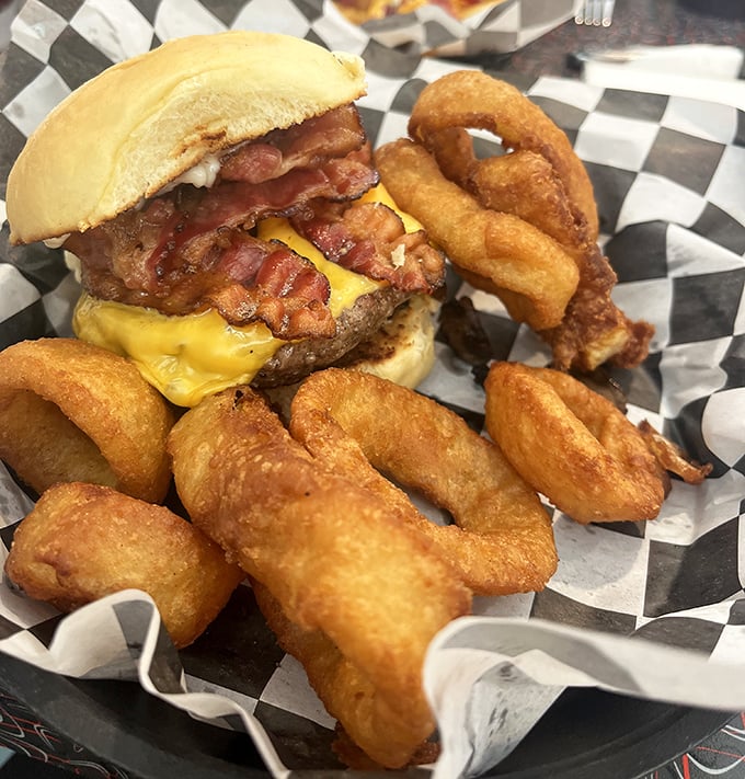 This burger doesn't just satisfy hunger&mdash;it obliterates it, with bacon and cheese melting into a beef patty that commands respect and onion rings standing guard.
