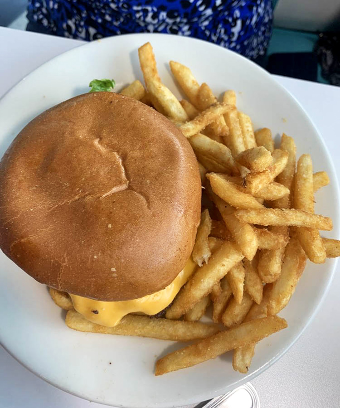 Simplicity perfected: a classic cheeseburger with golden fries. Some relationships are complicated; this one's been working flawlessly for decades.