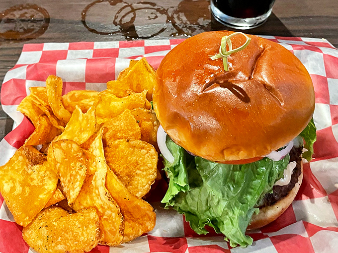 A burger that stands tall and proud, flanked by house-made chips that didn't come from a bag and never will. This is honest food.