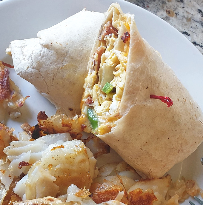 A breakfast burrito wrapped tighter than your favorite mystery novel, packed with morning goodness.