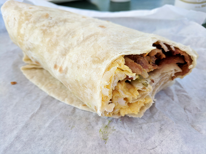 Breakfast burrito perfection: eggs, bacon, and cheese wrapped in a warm tortilla. The kind of morning fuel that makes mountain adventures possible.