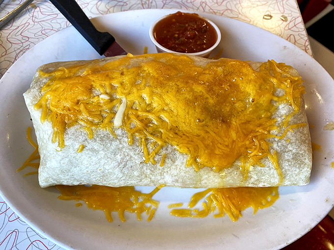 This breakfast burrito isn't messing around&mdash;it's a cheese-crowned behemoth that requires both hands and possibly a nap afterward.