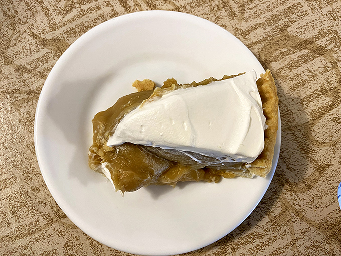 A slice of butterscotch pie that makes time stand still. The sweet, caramel-kissed filling topped with a mountain of whipped cream is worth every calorie.