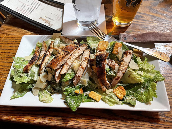 A Caesar salad that Julius himself would approve of, with blackened chicken standing at attention like soldiers guarding flavor territory.
