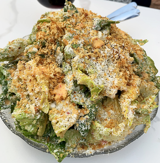 A Caesar salad that refuses to be a boring opening act. Those breadcrumbs are the backup singers that steal the show.