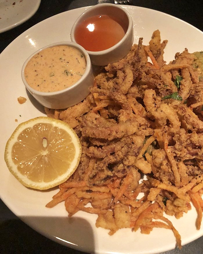 Calamari that defies the rubbery stereotype &ndash; crispy, tender, and served with dipping sauces that'll make you forget ketchup exists.