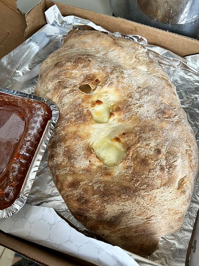 The calzone&mdash;pizza's introverted cousin&mdash;hides its treasures inside a golden-brown dome that's practically bursting with molten cheese and fillings.