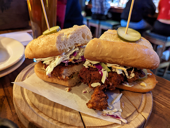The legendary Carolina pork sandwich in its natural habitat. Notice how the pickles stand guard like delicious sentinels of flavor.