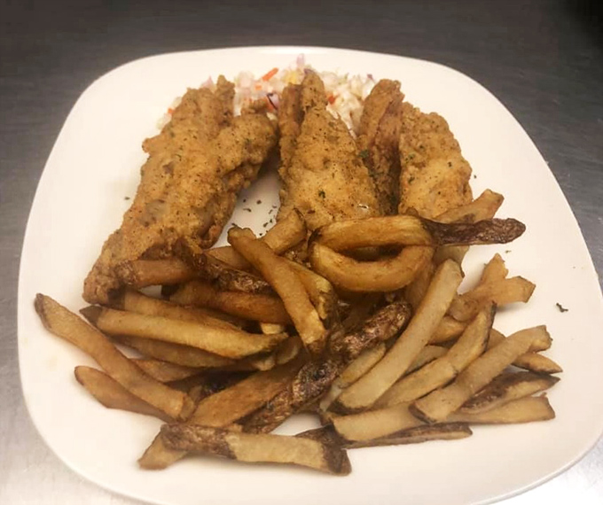 Crispy catfish and golden fries - proof that sometimes the simplest pleasures are the most satisfying.