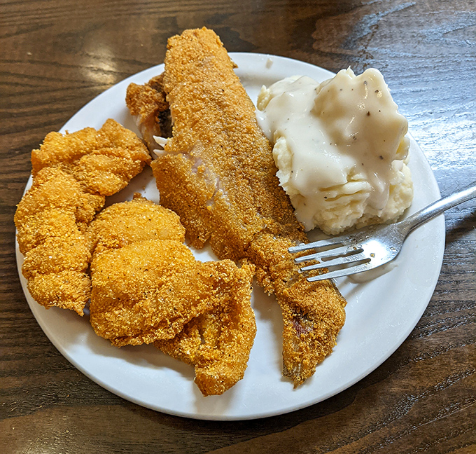 Cornmeal-crusted catfish that would make Mark Twain homesick, paired with mashed potatoes that clearly never met a box in their life.