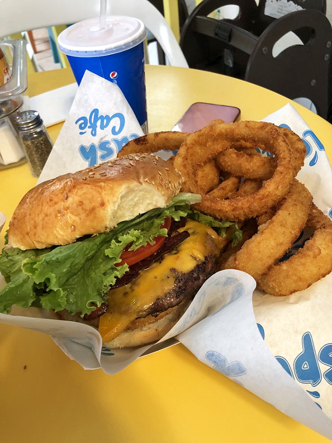 A burger with onion rings because sometimes you need a break from seafood excellence &ndash; but just a small one.