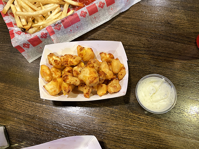 Wisconsin's favorite food group: cheese curds. Golden-fried pillows of dairy delight that squeak their way into your heart.
